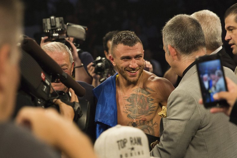 Lomachenko stops Linares in 10th for historic win