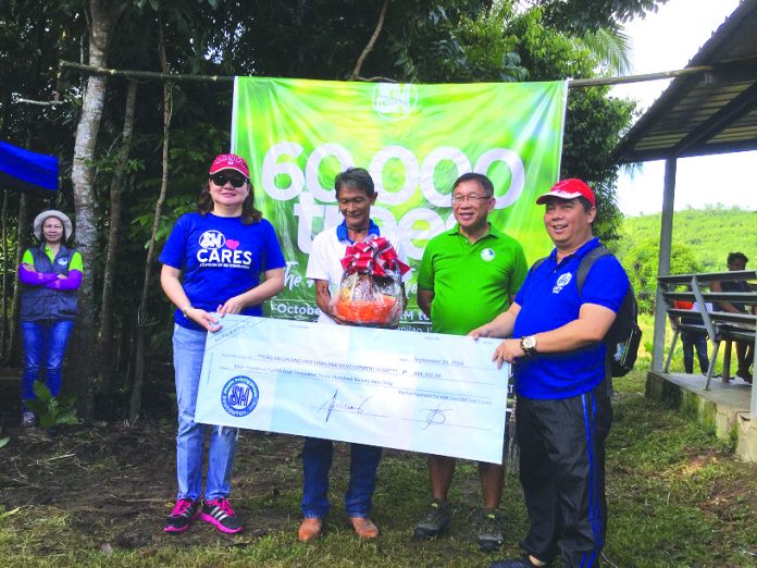 SM leads tree-planting activity in Anilao
