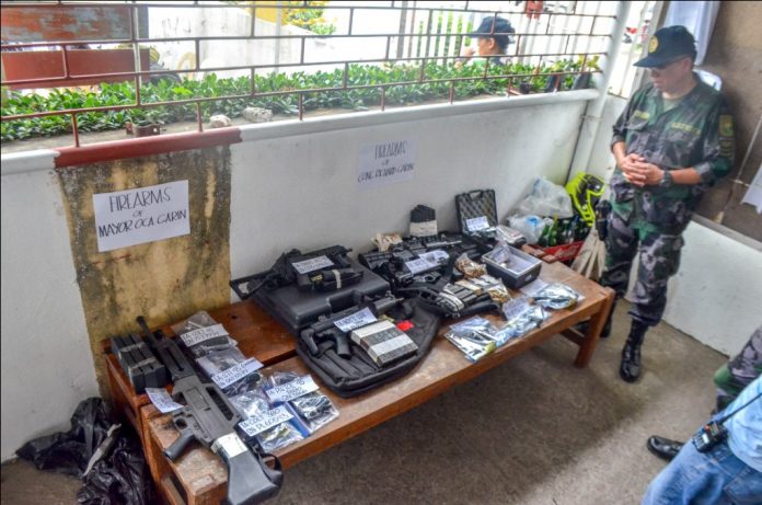 GARINS GIVE UP 14 GUNS