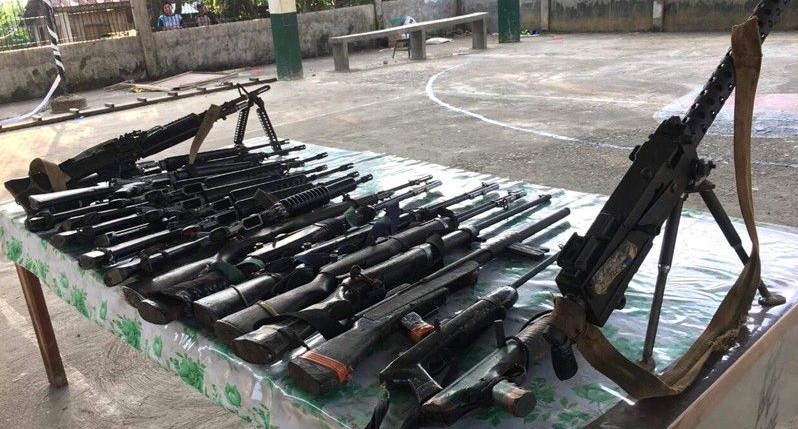 Former rebels turnover firearms to Cadiz cops