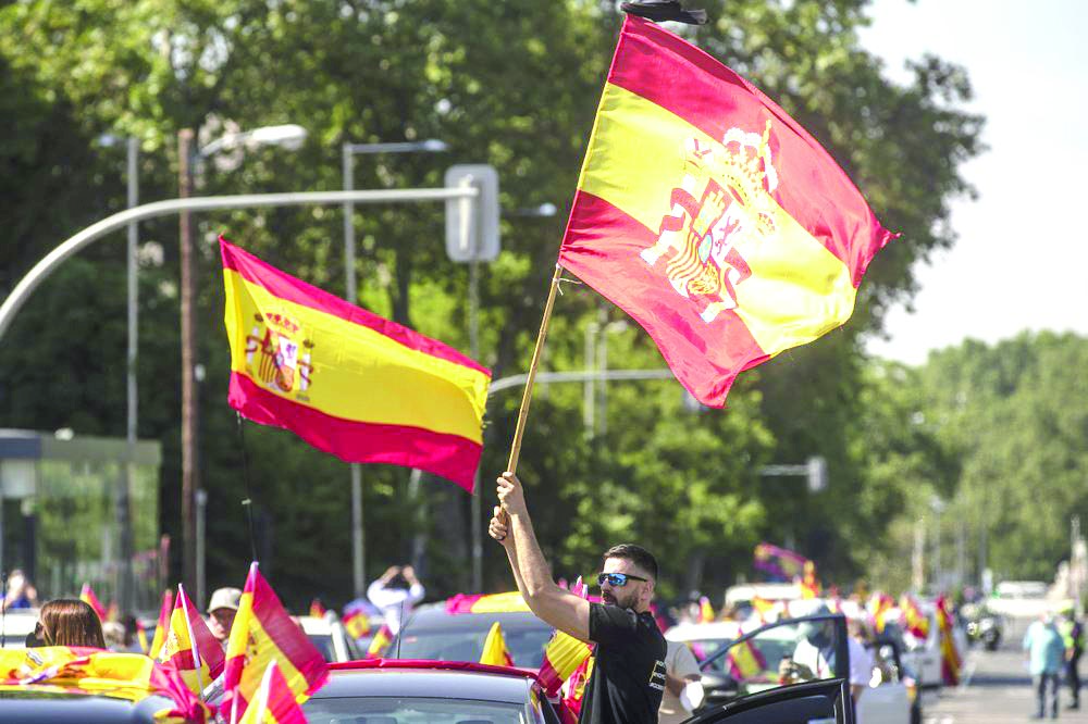 Spain’s far-right holds car protest vs virus lockdown