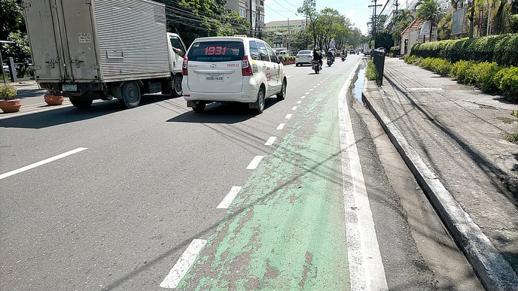 Rain leads to bike lane paint fail
