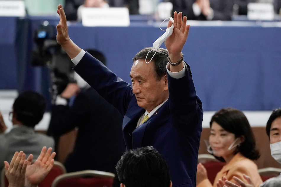 Japan’s new leader picks team: Familiar men, fewer women