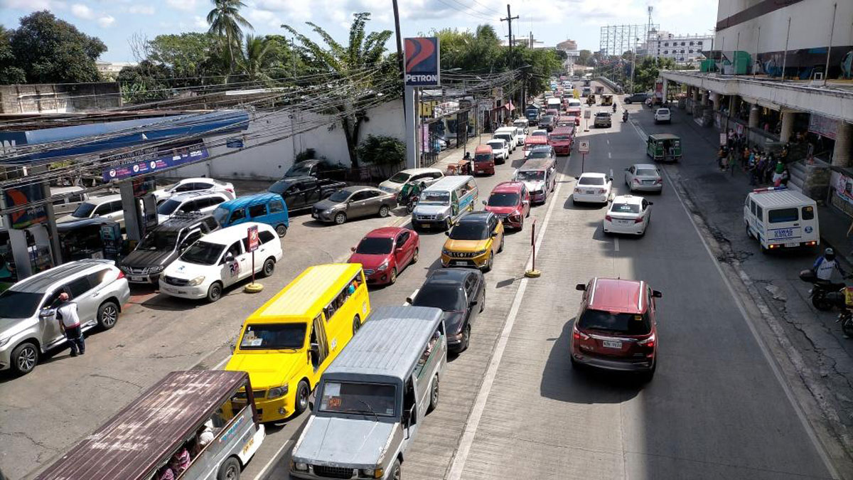 CHAOTIC TRAFFIC; Oil firm hit over traffic jams caused by 50% off promo