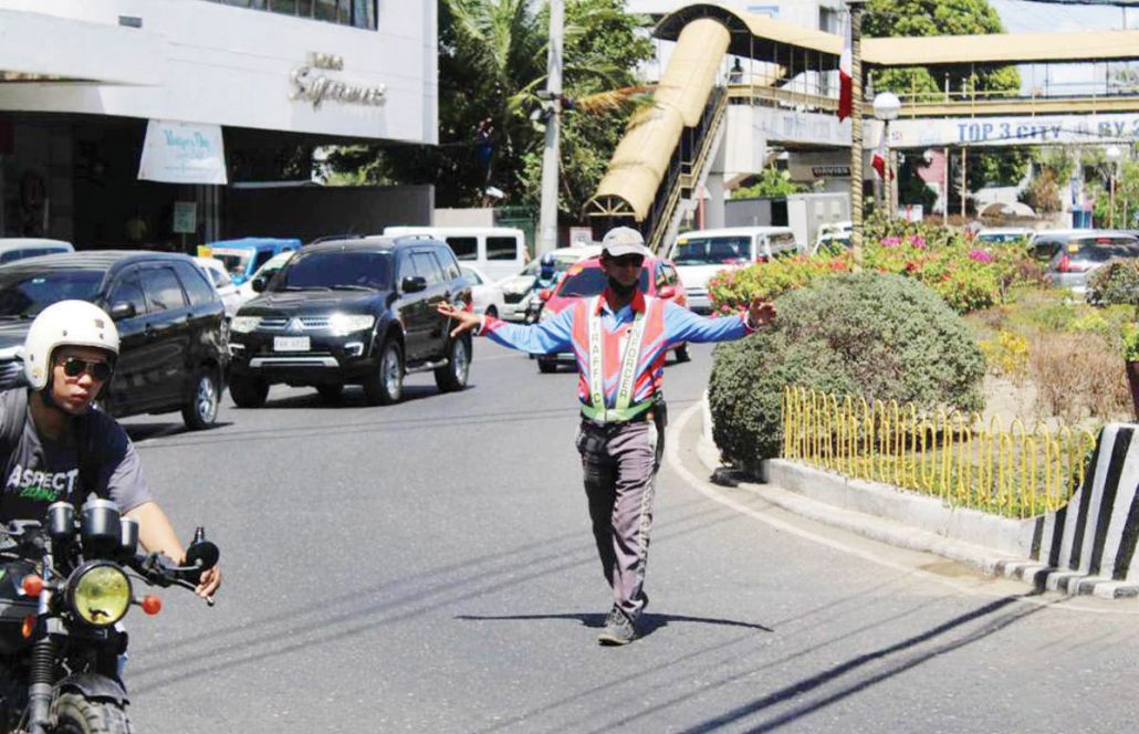 TRAFFIC AIDES GET ‘HEATSTROKE BREAKS’; Iloilo City seeks to balance ...