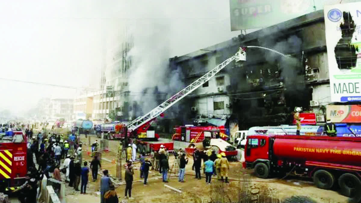 At least 21 dead, dozens missing in Pakistan mall fire